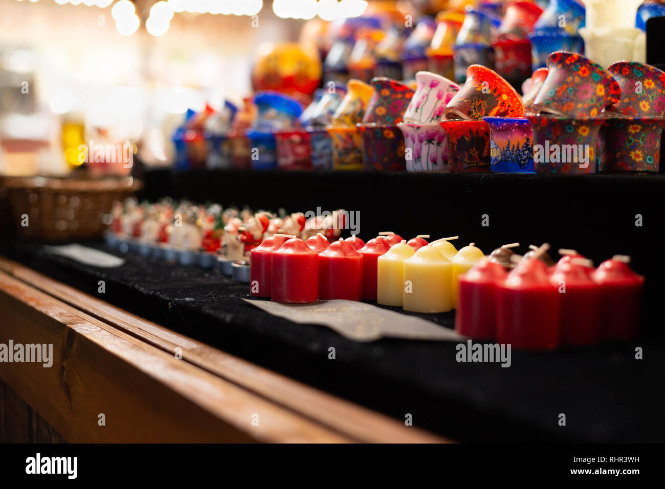 multi color candles at christmas market Stock Photo - Alamy