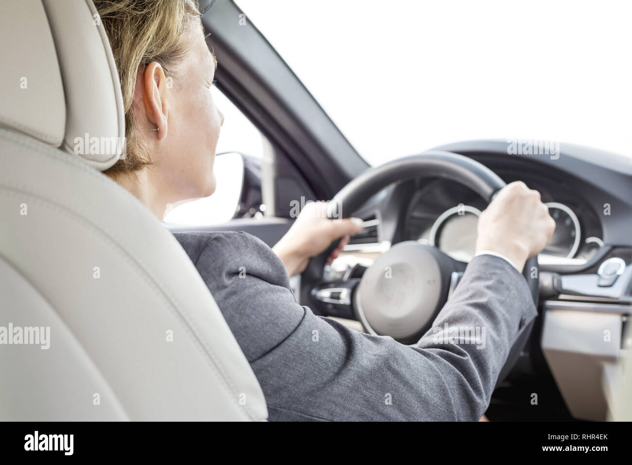 Mature executive driving car during business trip Stock Photo - Alamy