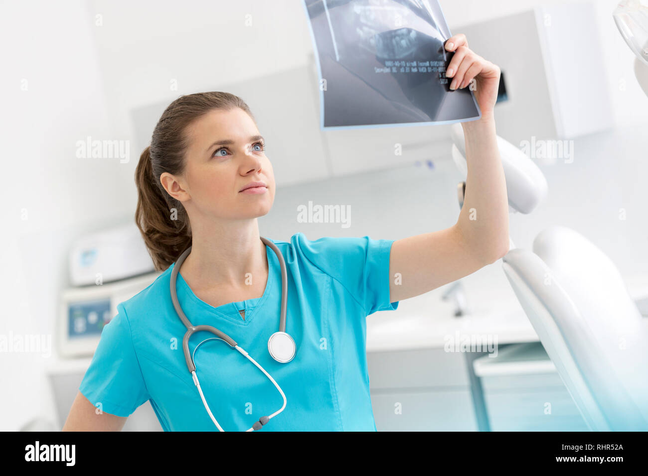 Doctor examining medical x-ray at dental clinic Stock Photo - Alamy