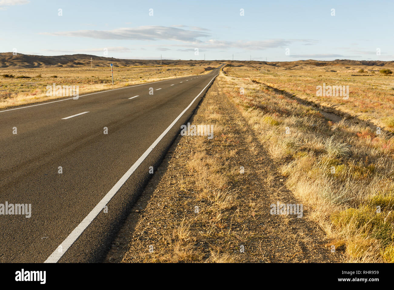 asphalt road Sainshand Zamiin-Uud in Mongolia, Gobi Desert Stock Photo ...