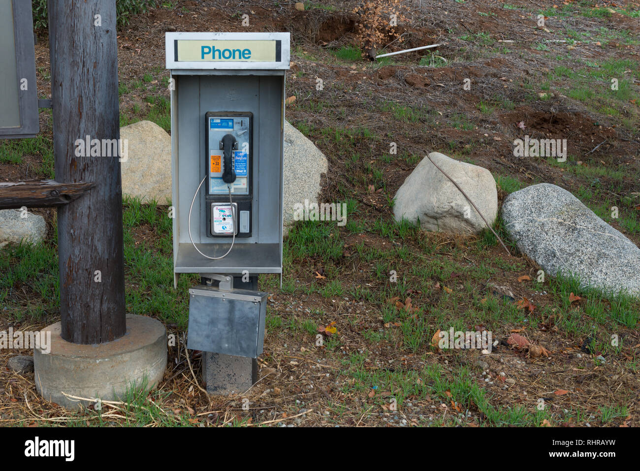 Old fashioned outdoor payphone phone booth Stock Photo - Alamy