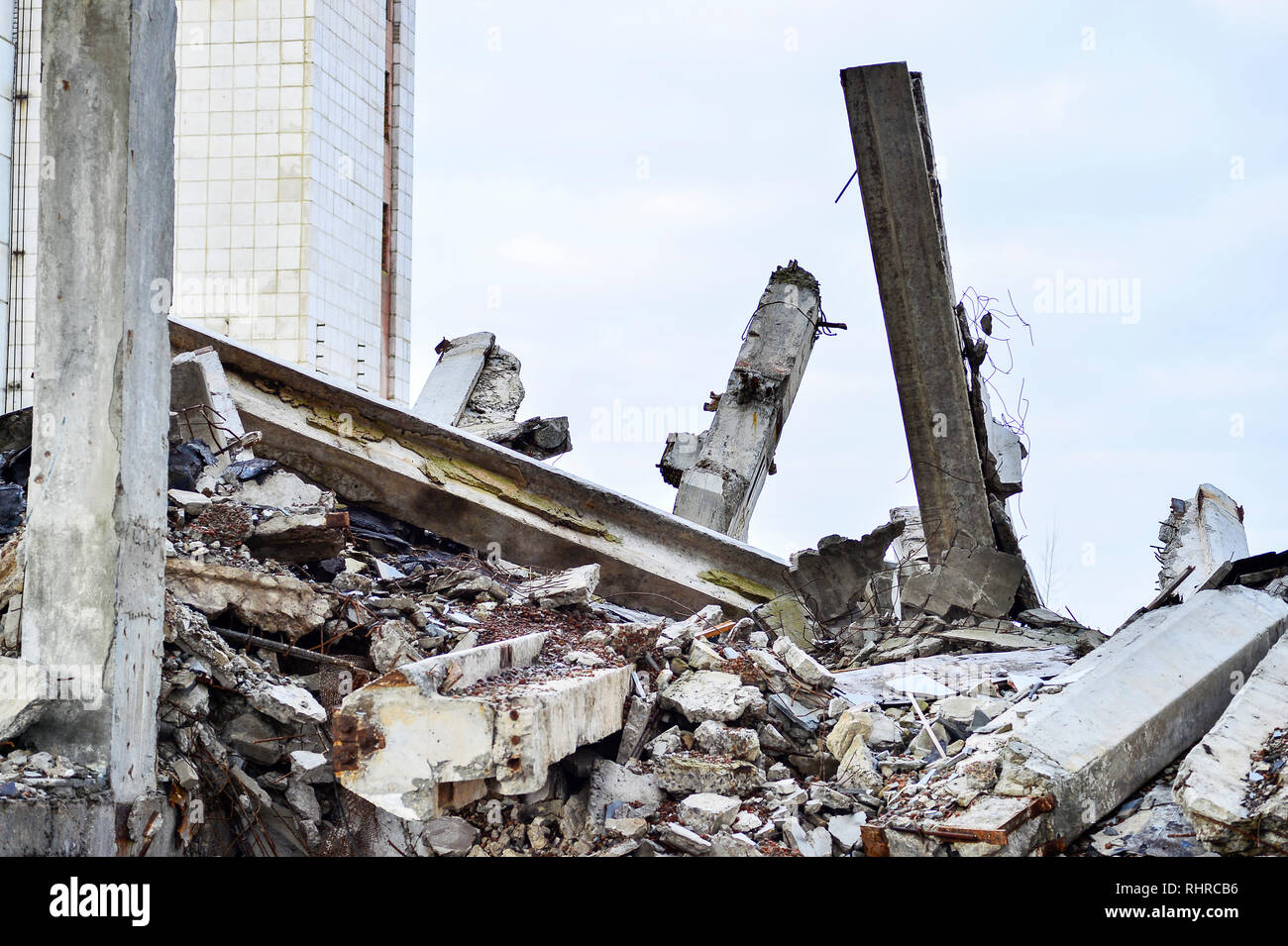 Remains of the destroyed industrial building. Large concrete piles ...