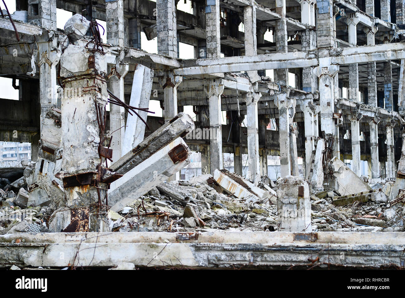 Remains of the destroyed industrial building. The skeleton of a large ...