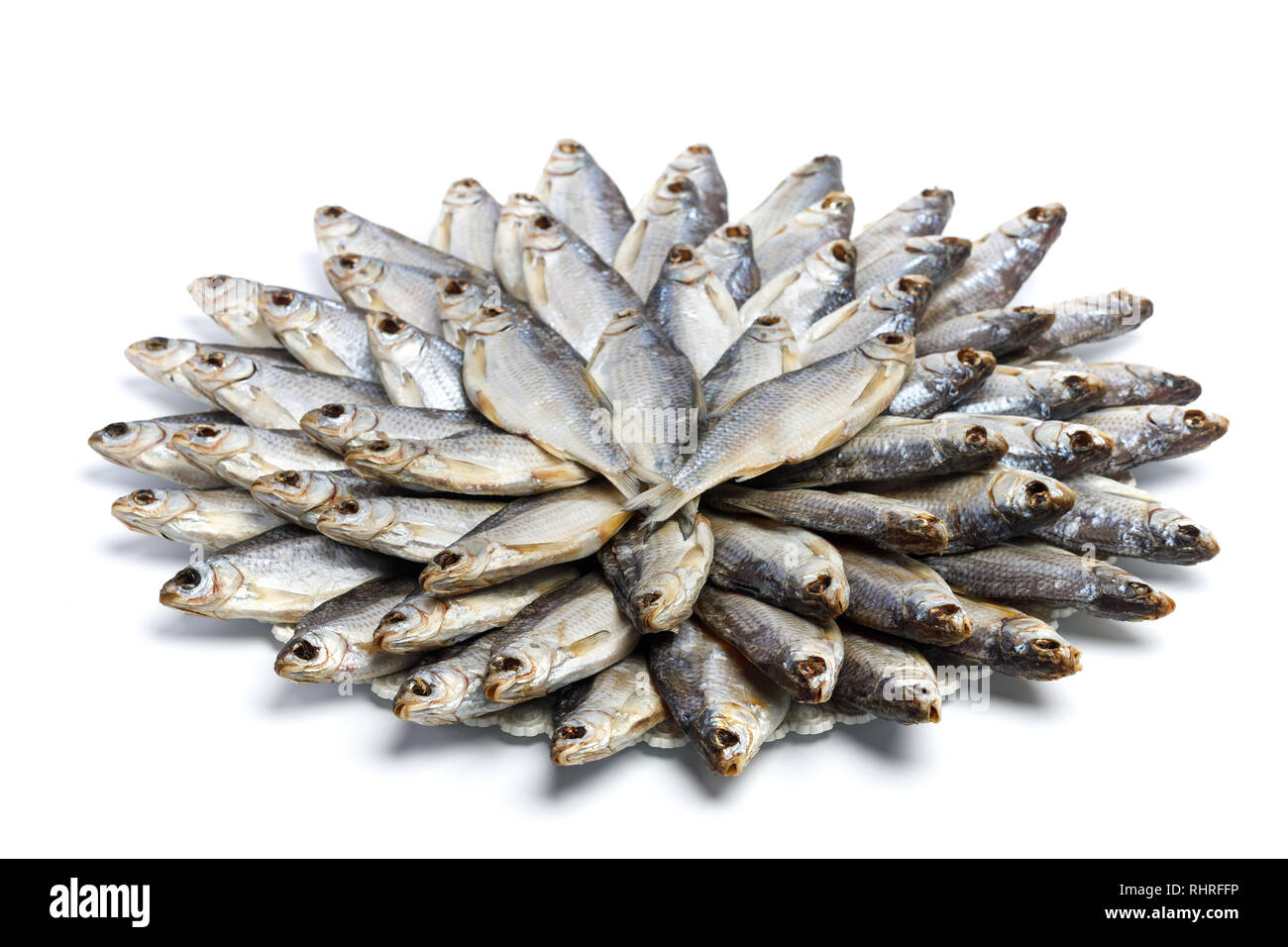 Large heap of dried salted sea roach laid out in the form of a circle ...