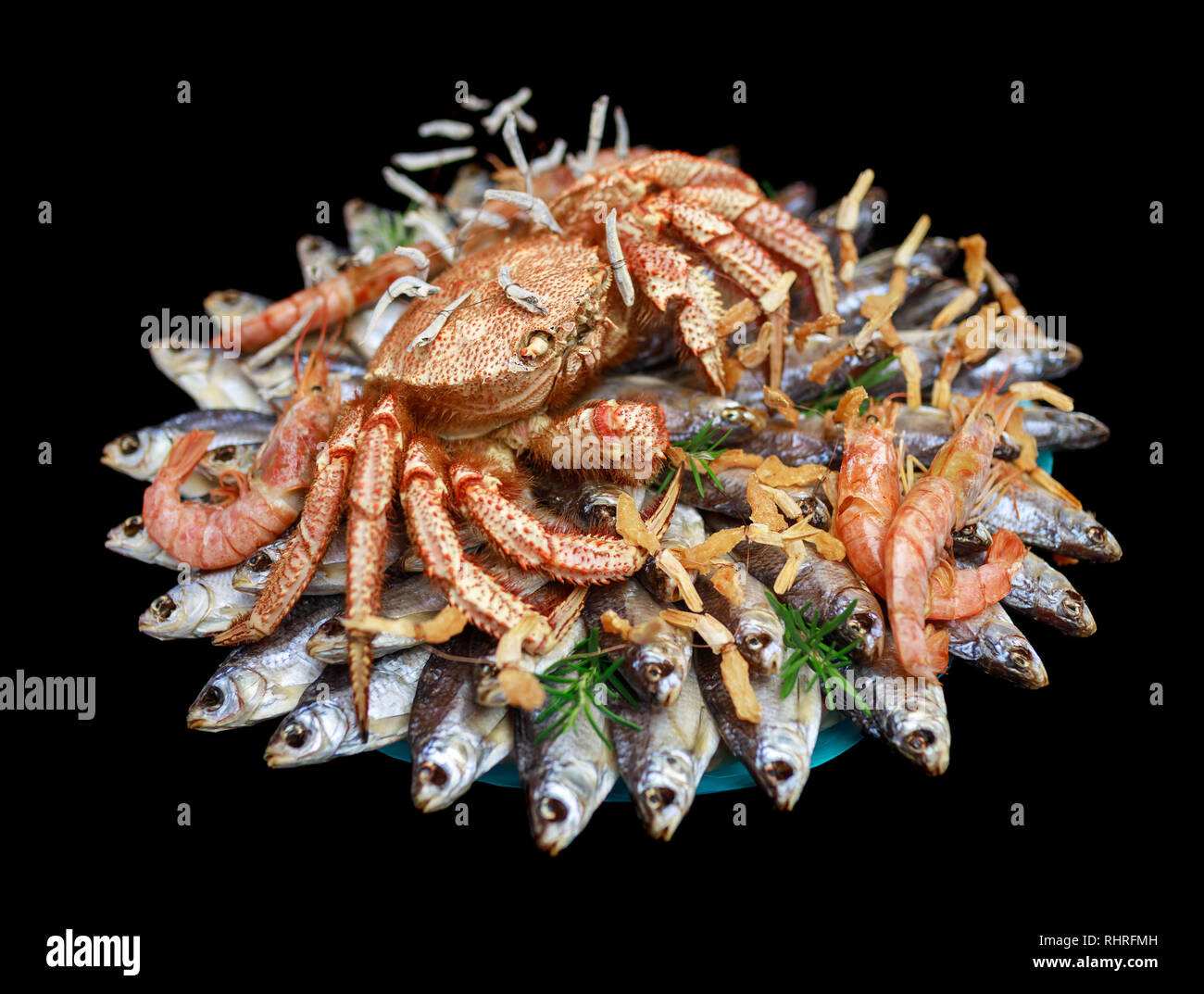 Big hairy boiled crab sits on a heap of dried salted fish on a gift ...