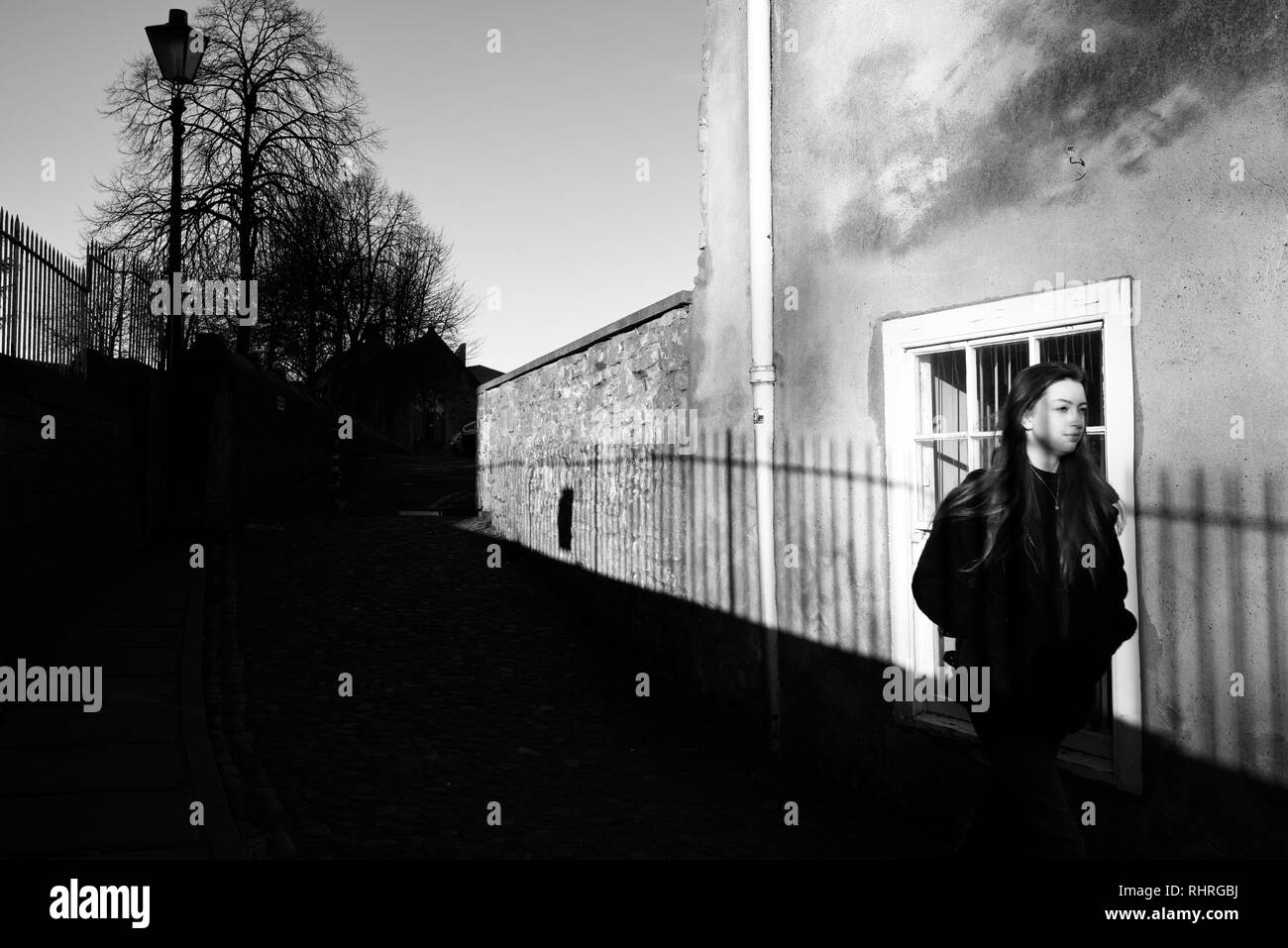 Student Walking In Durham City Caught in the shadows of the bars from ...