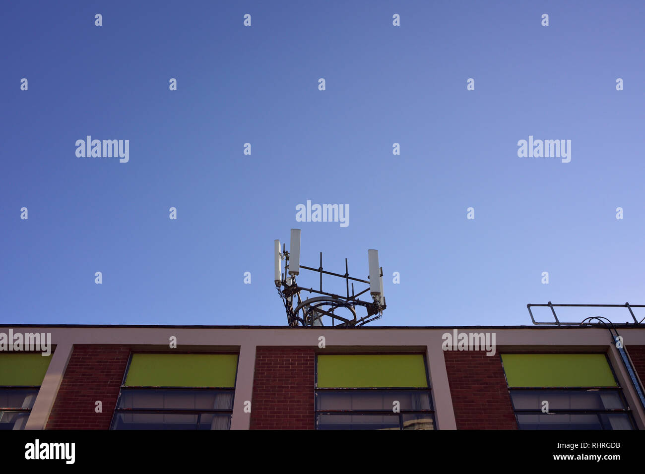 Mobile phone transmitter on roof of building in bury lancashire uk ...