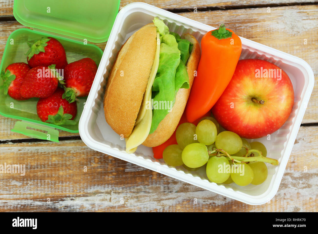 Healthy school lunchbox containing cheese sandwich with lettuce ...