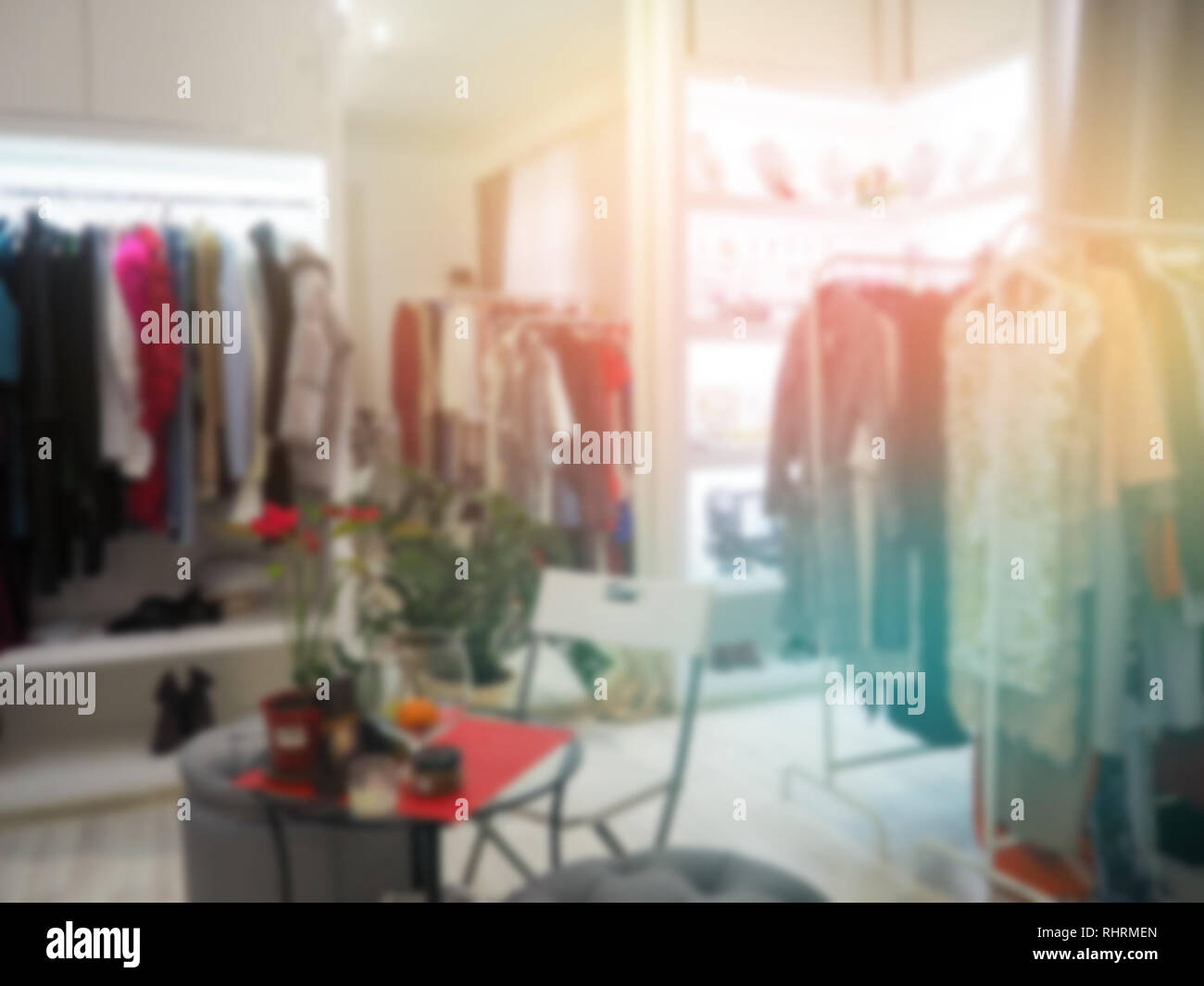 blurred clothes on hanger in clothing store. Abstract blur and ...