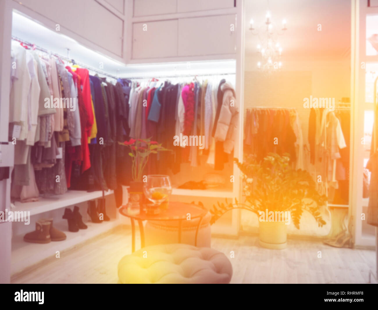 blurred clothes on hanger in clothing store. Abstract blur and ...