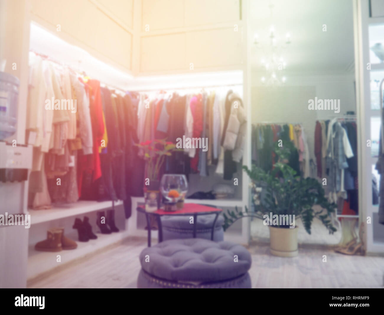 blurred clothes on hanger in clothing store. Abstract blur and ...