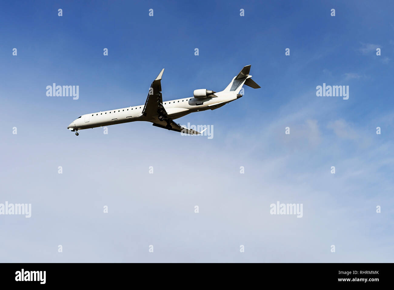 Airplane is flying above close to the ground Stock Photo - Alamy