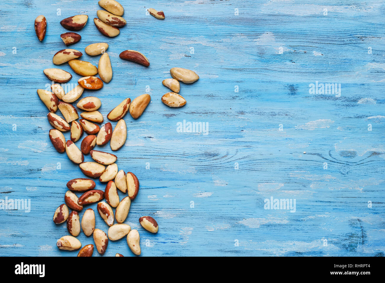 Brazil nuts on blue Stock Photo - Alamy