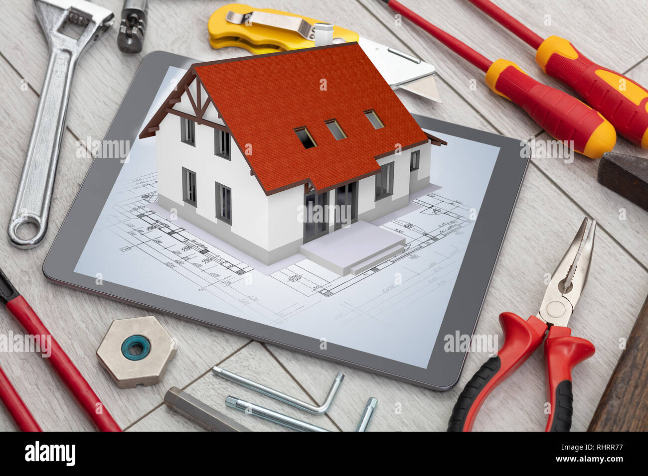Tablet with construction tools and 3d home plan concept Stock Photo - Alamy