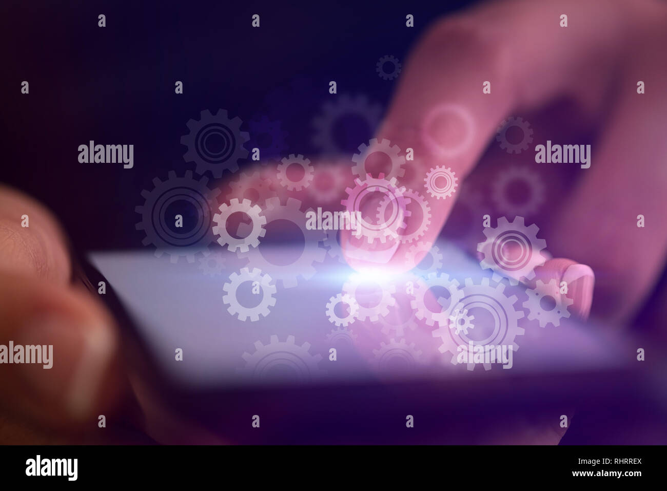 Finger setting the phone with dark background Stock Photo - Alamy