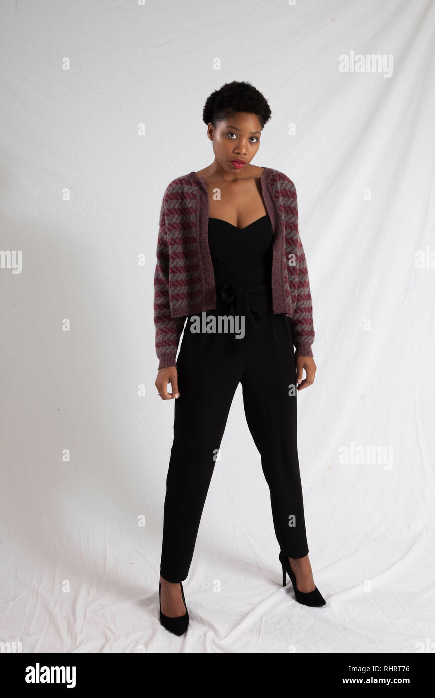 Woman in jacket standing hi-res stock photography and images - Alamy