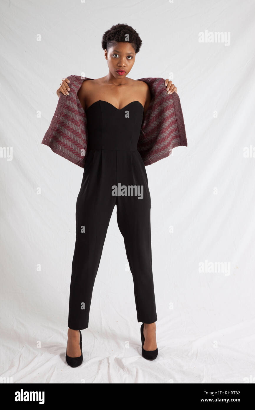 Lovely black woman opening her jacket Stock Photo - Alamy