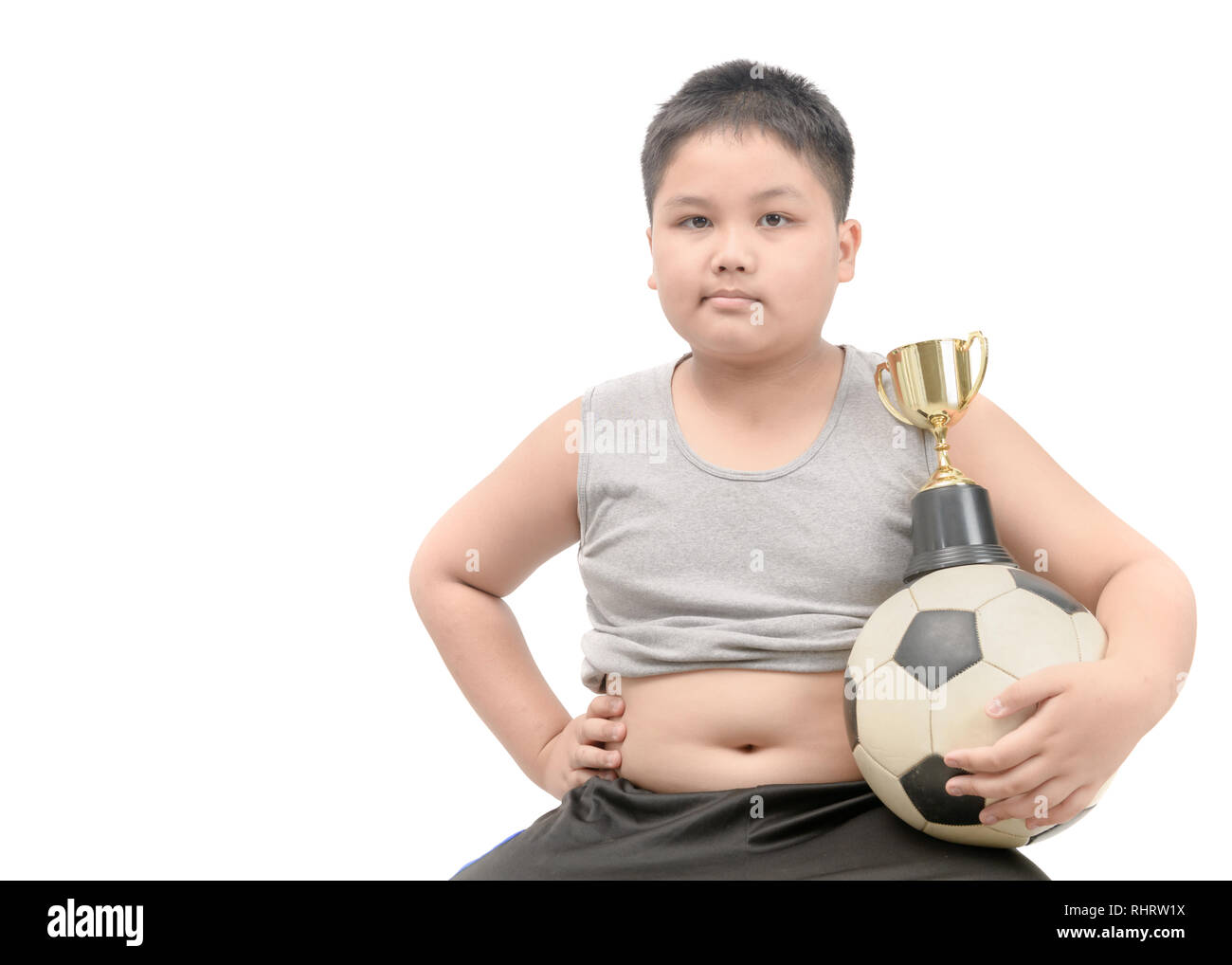 Obese fat boy holding football and trophy cup isolated over white, diet ...
