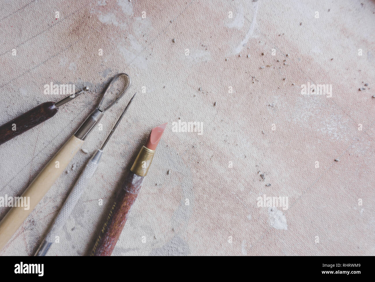 Close up view from above of typical ceramics tools / art supplies in a ...