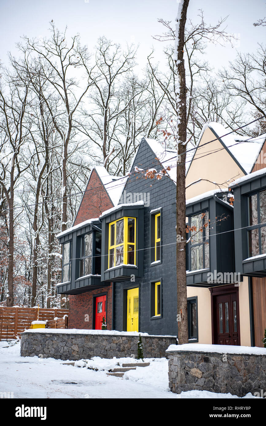 stylish modern buildings in cold winter with snow on roofs Stock Photo ...
