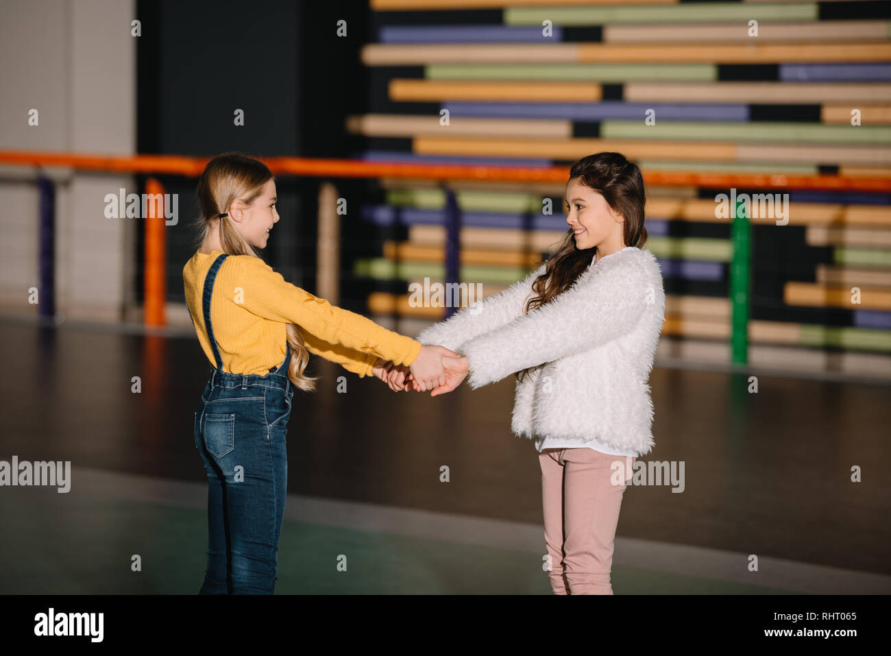 Two beautiful children smiling and holding hands Stock Photo - Alamy