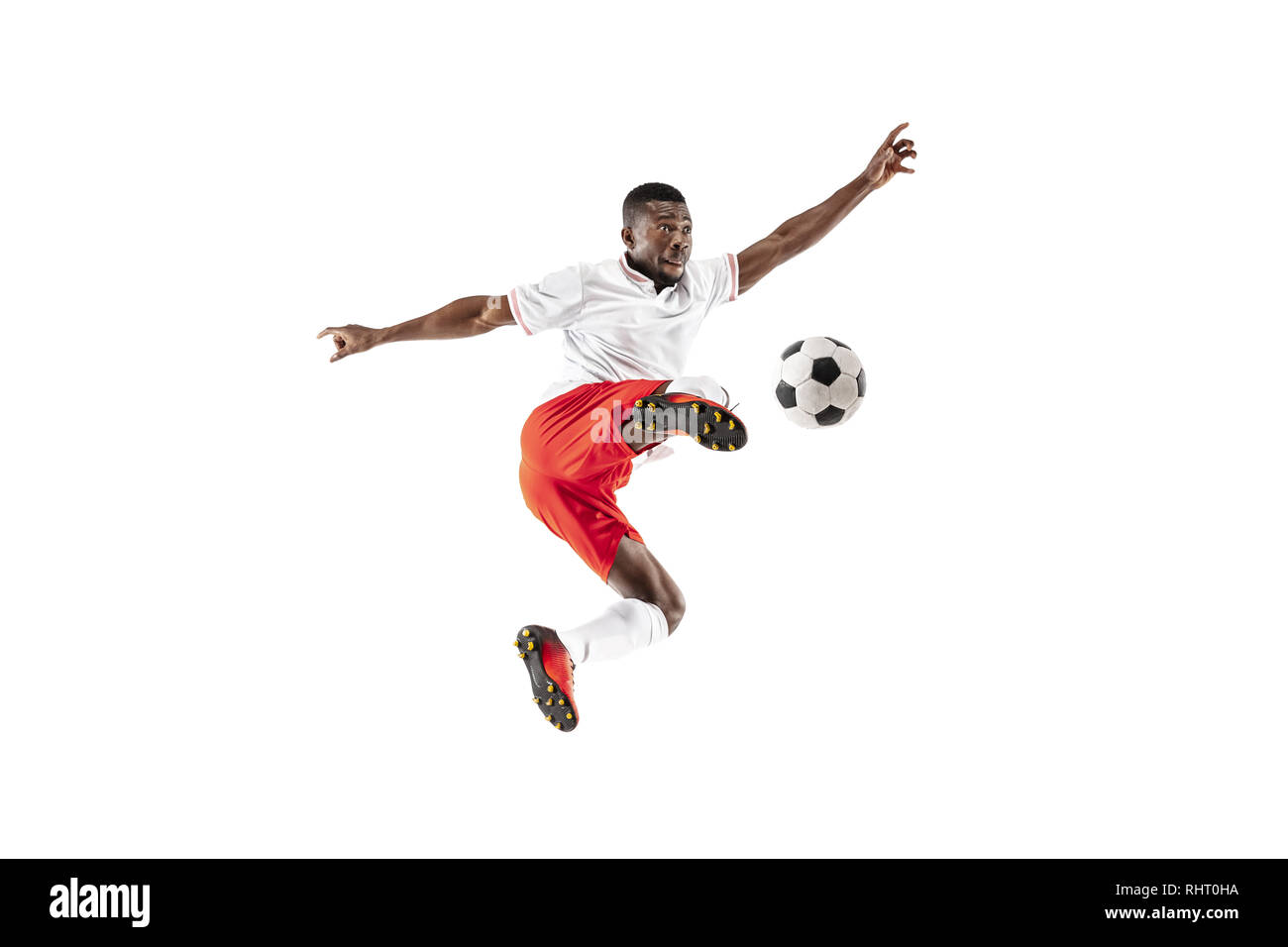 Professional african american football soccer player in motion isolated ...