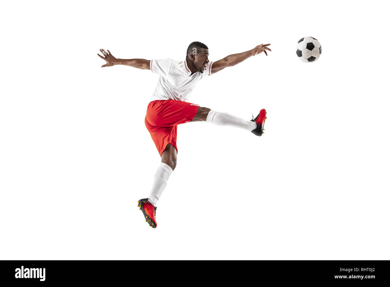 Professional african american football soccer player in motion isolated ...