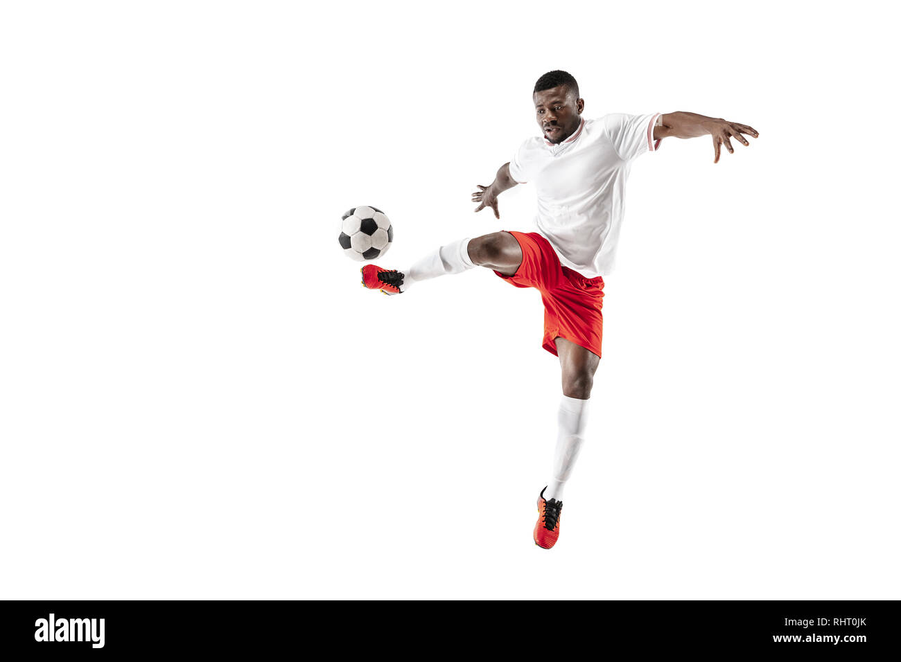 Professional african american football soccer player in motion isolated ...