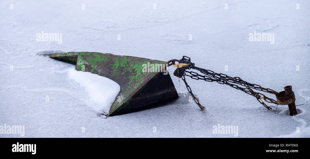 Boat frozen in cold ice at winter Stock Photo - Alamy
