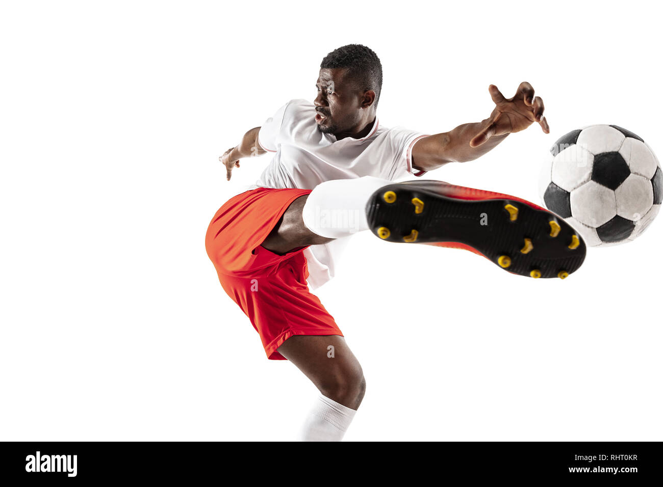 Professional african american football soccer player in motion isolated ...