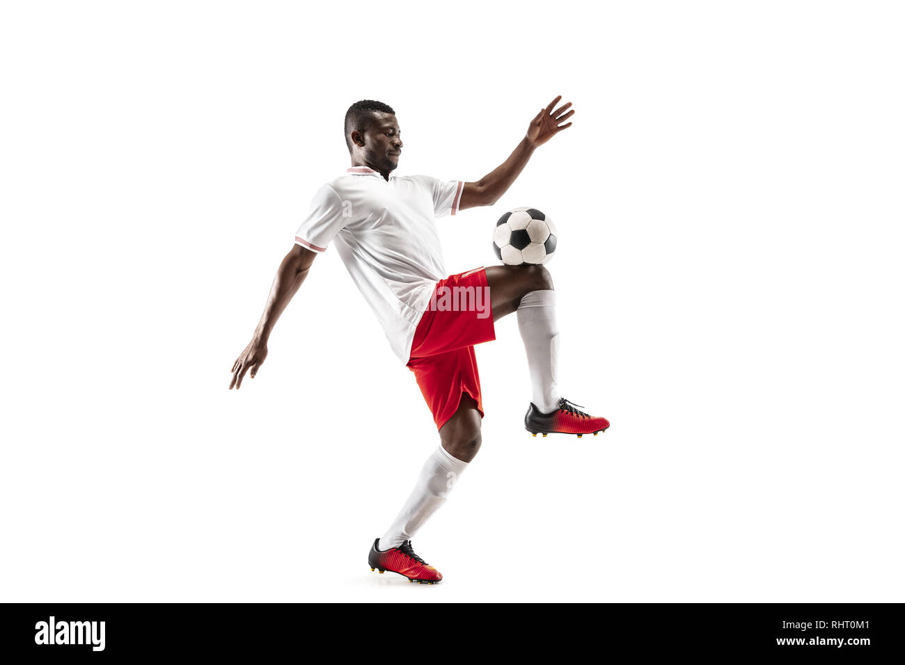 Professional african american football soccer player in motion isolated ...