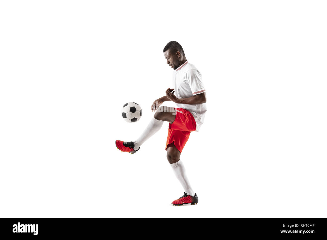 Professional african american football soccer player in motion isolated ...