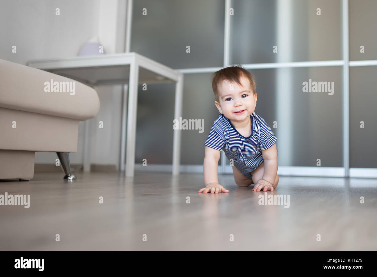 happy crawling baby boy at home on the floor Stock Photo - Alamy