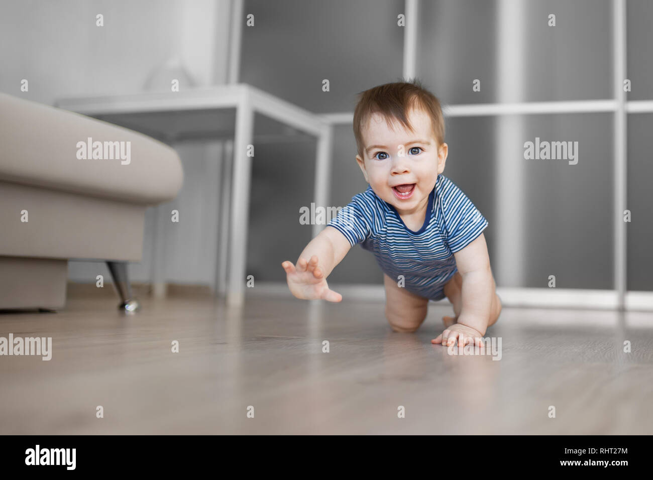 happy crawling baby boy at home on the floor Stock Photo - Alamy