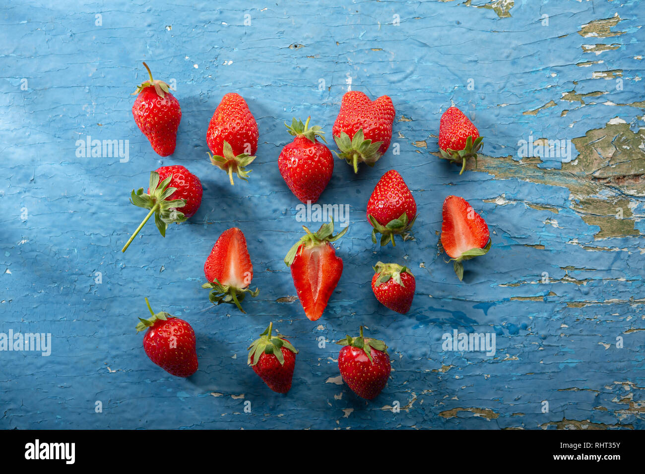 Strawberry on blue background Stock Photo - Alamy