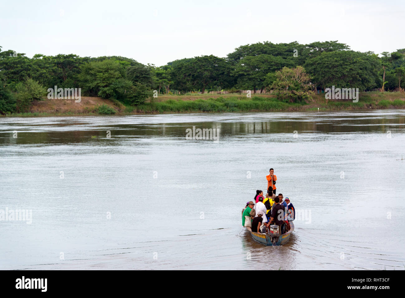 MOMPOX, COLOMBIA - MAY 27: Small crowded boat crosses the Magdalena in ...