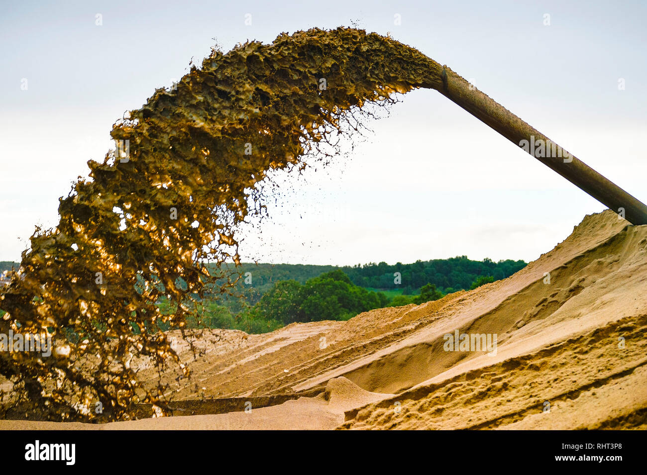 Industrial extraction of sand for construction. From the pipe ...