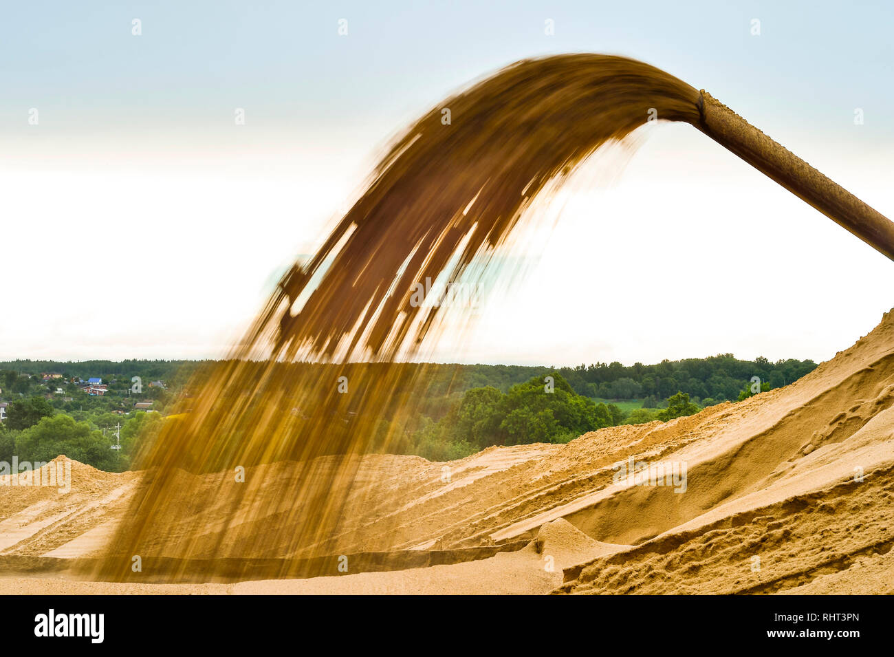 Industrial extraction of sand for construction. From the pipe ...