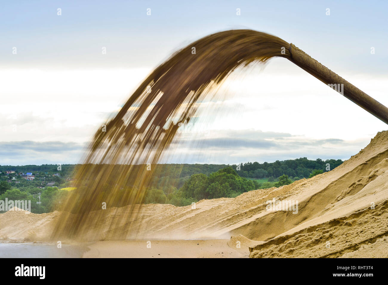 Industrial extraction of sand for construction. From the pipe ...
