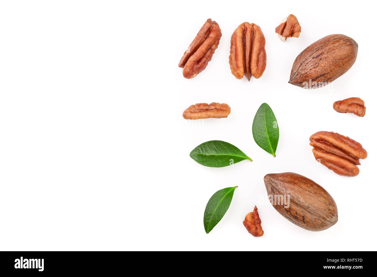 pecan nut decorated with green leaves isolated on white background. Top ...