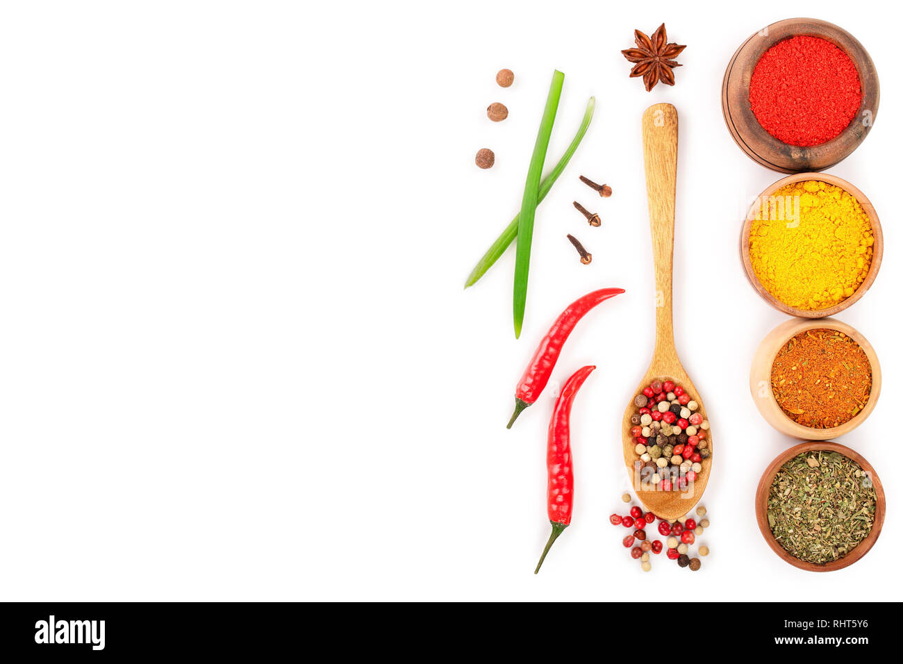 mix of spices in wooden bowl isolated on a white background with copy ...