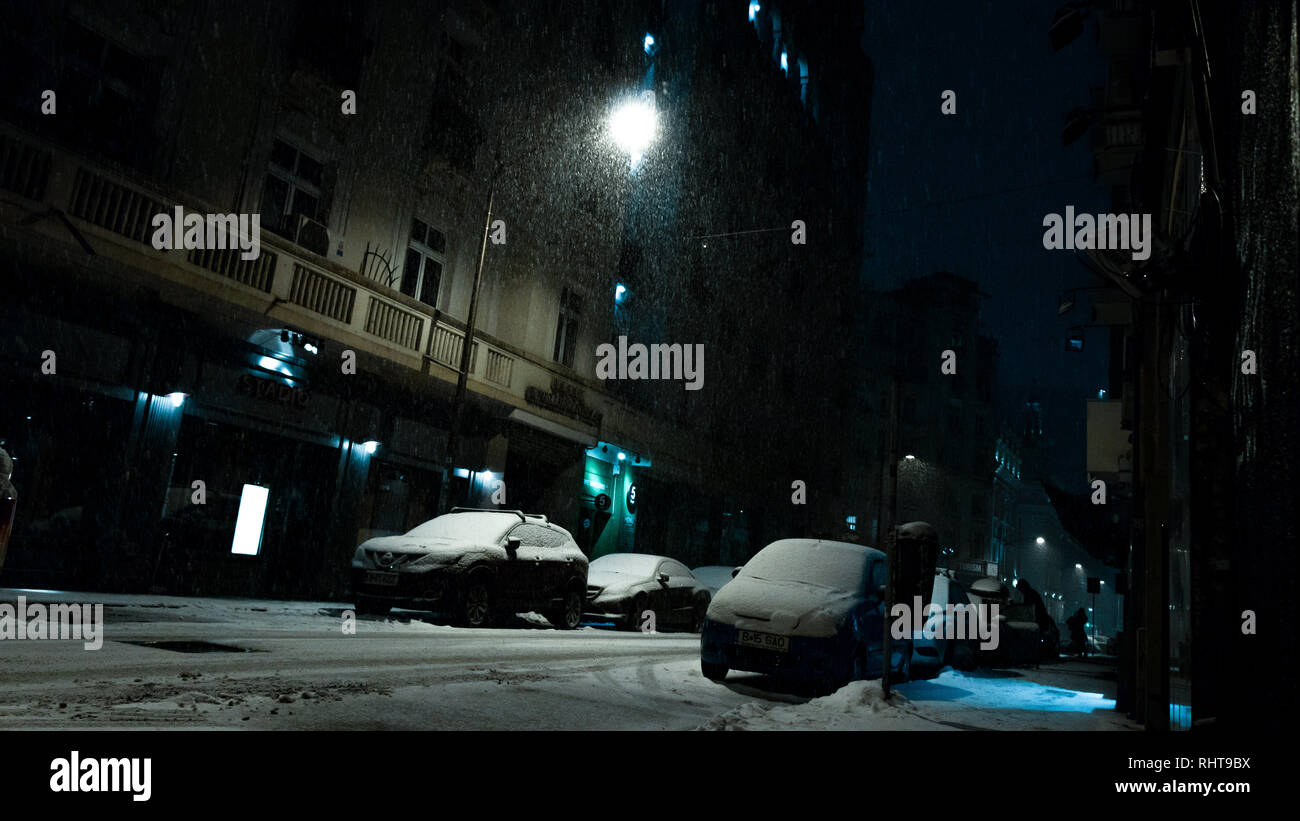 Snowing in the street at night Stock Photo - Alamy