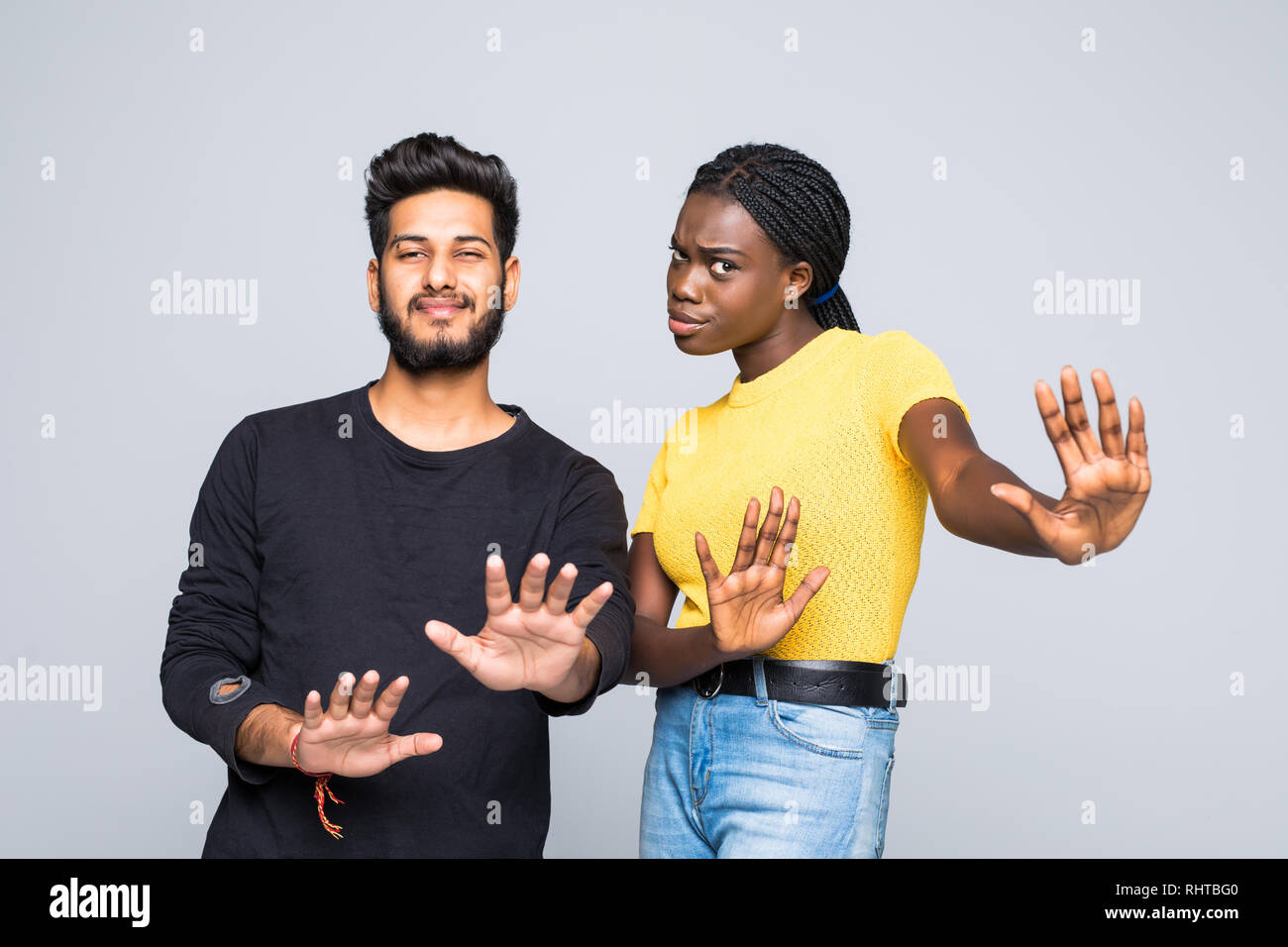 Portrait of young multiracial couple indian man and african woman no ...
