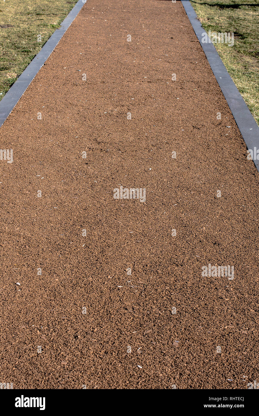 Rubber running path in a park in view Stock Photo - Alamy