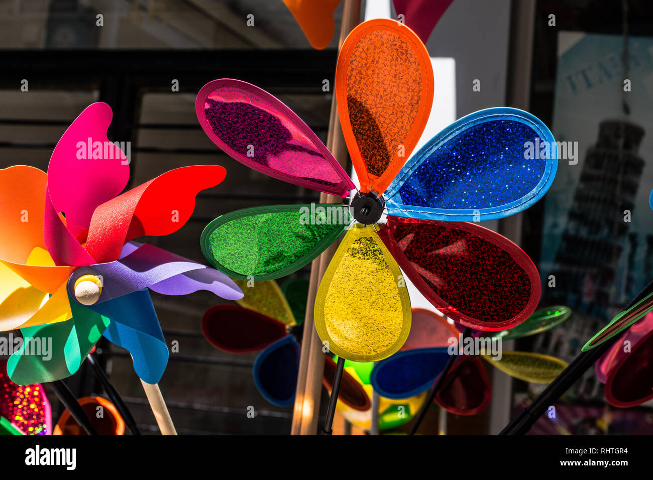 Rainbow colored pinwheels on sale in the view Stock Photo - Alamy