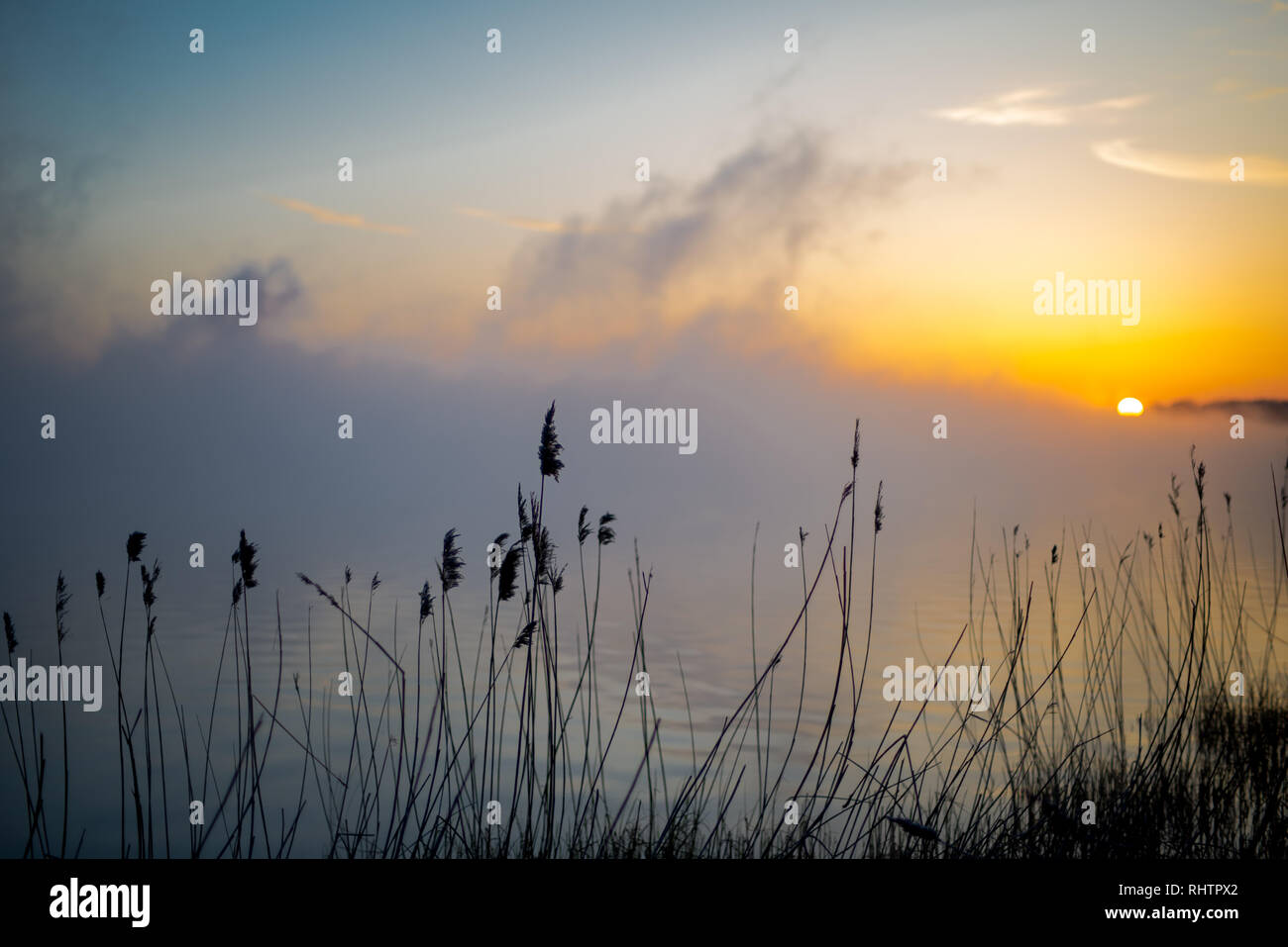 Freezing mist over cooling lake Stock Photo - Alamy