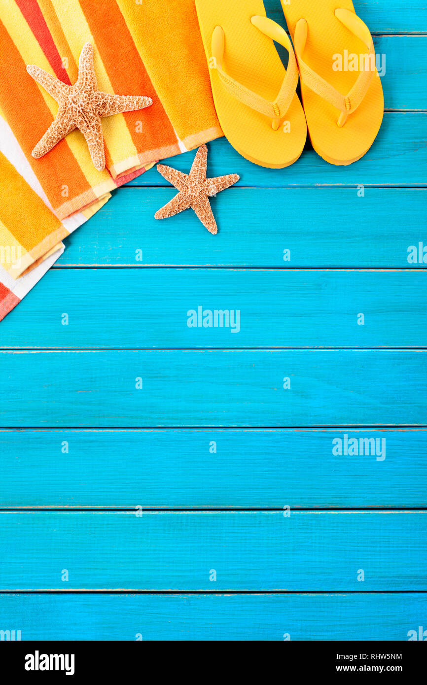 Summer beach objects border, flip flops, copy space, vertical, blue ...