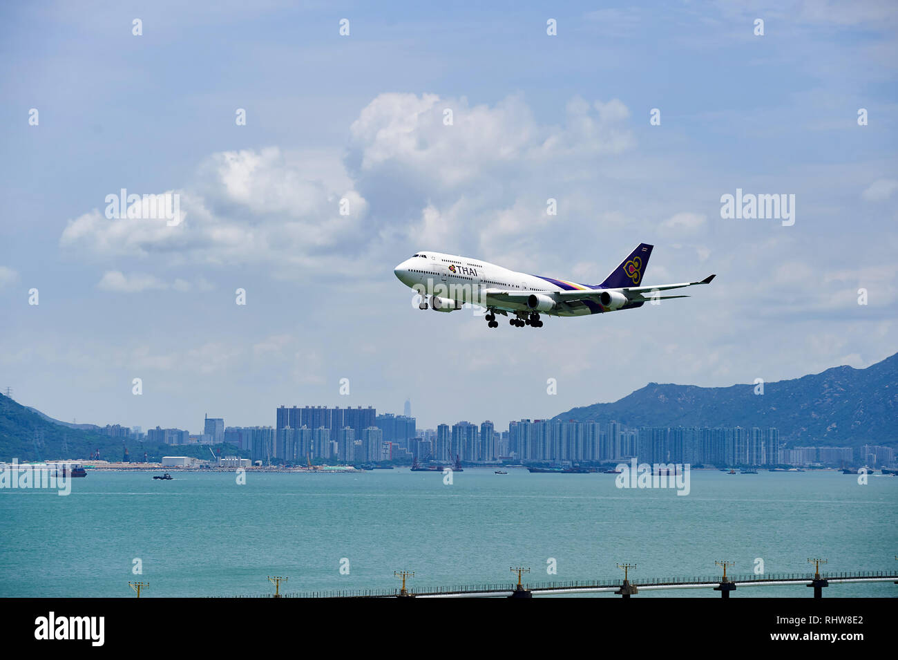 HONG KONG - JUNE 04, 2015: THAI aircraft landing at Hong Kong airport ...