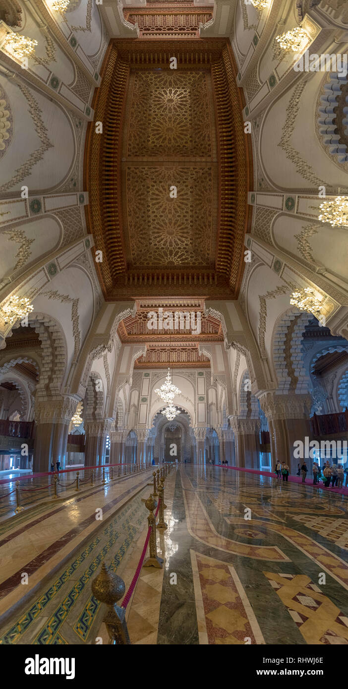 Inside Hassan II Mosque interior corridor with columns. Arabic arches ...