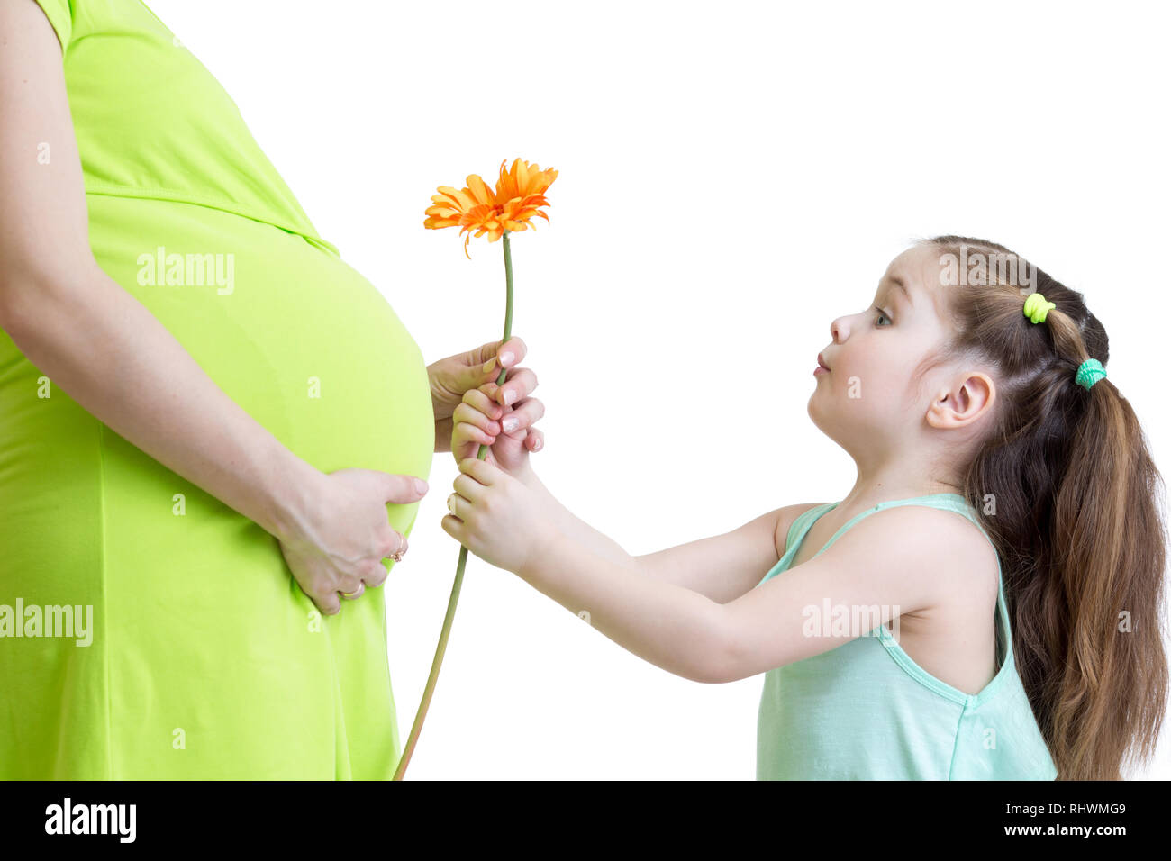 happy child giving flower to her pregnant mother Stock Photo - Alamy